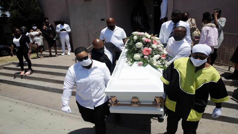 FILE - In this July 21, 2020, file photo, pall bearers carry a casket ...