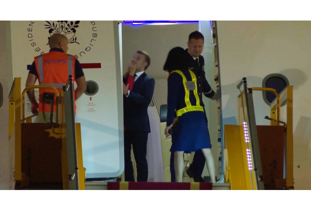 France's first lady seems to push her husband as they land in Vietnam ...